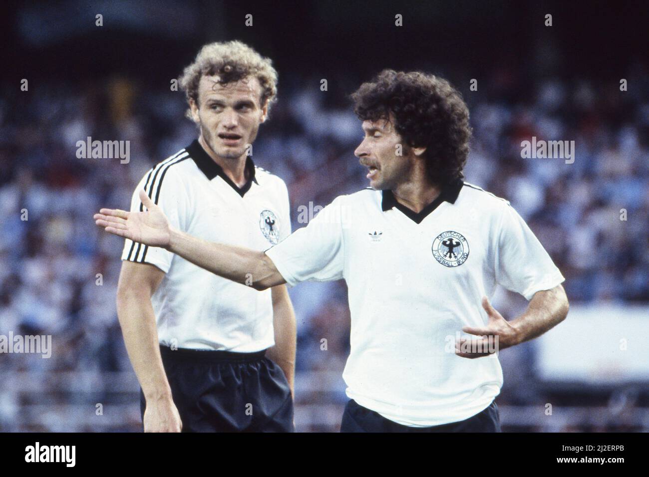 left to right Hans-Peter BRIEGEL and Paul BREITNER (GER), discussing ...