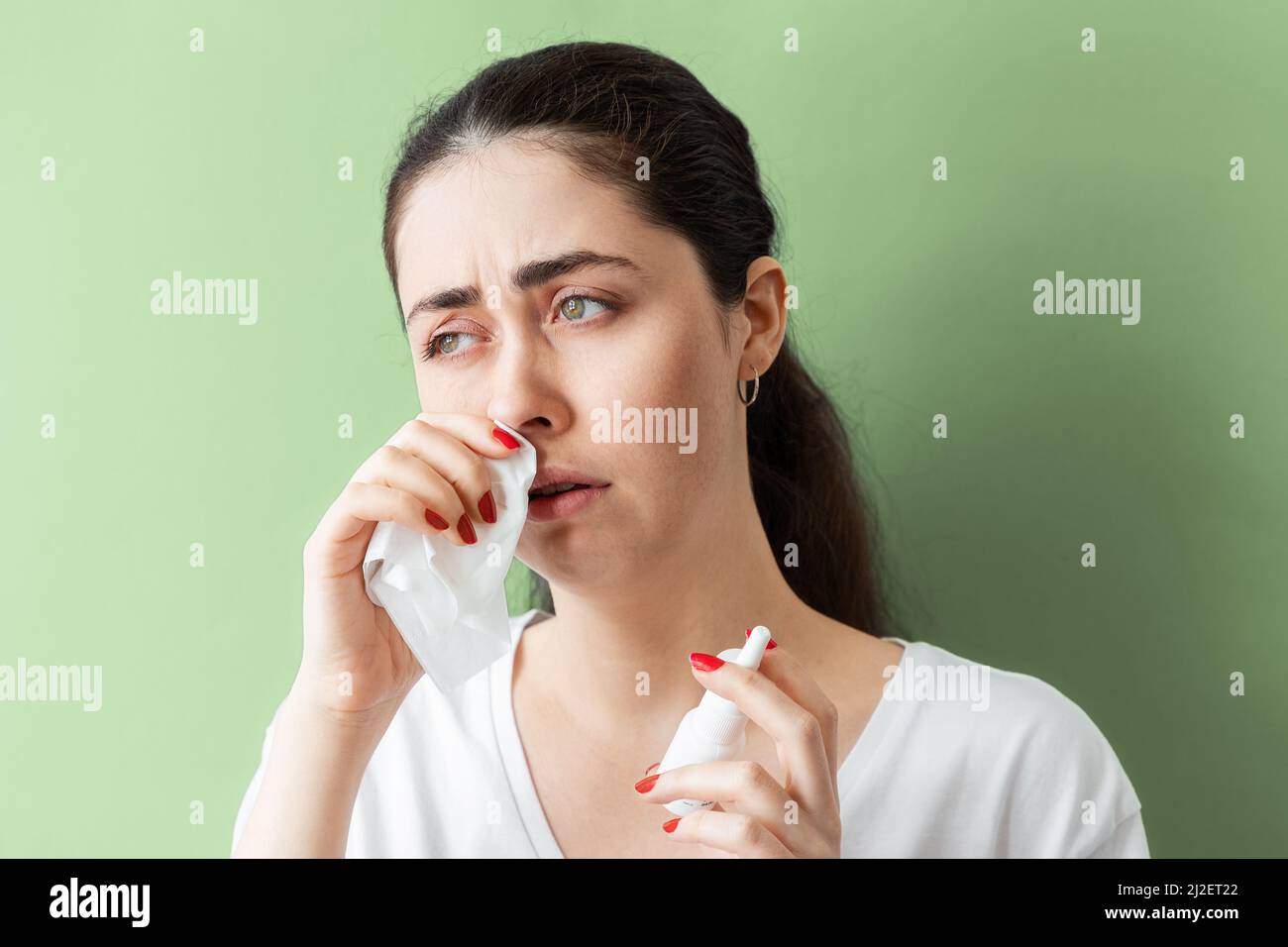 Woman wiping nose with hand hi-res stock photography and images - Alamy