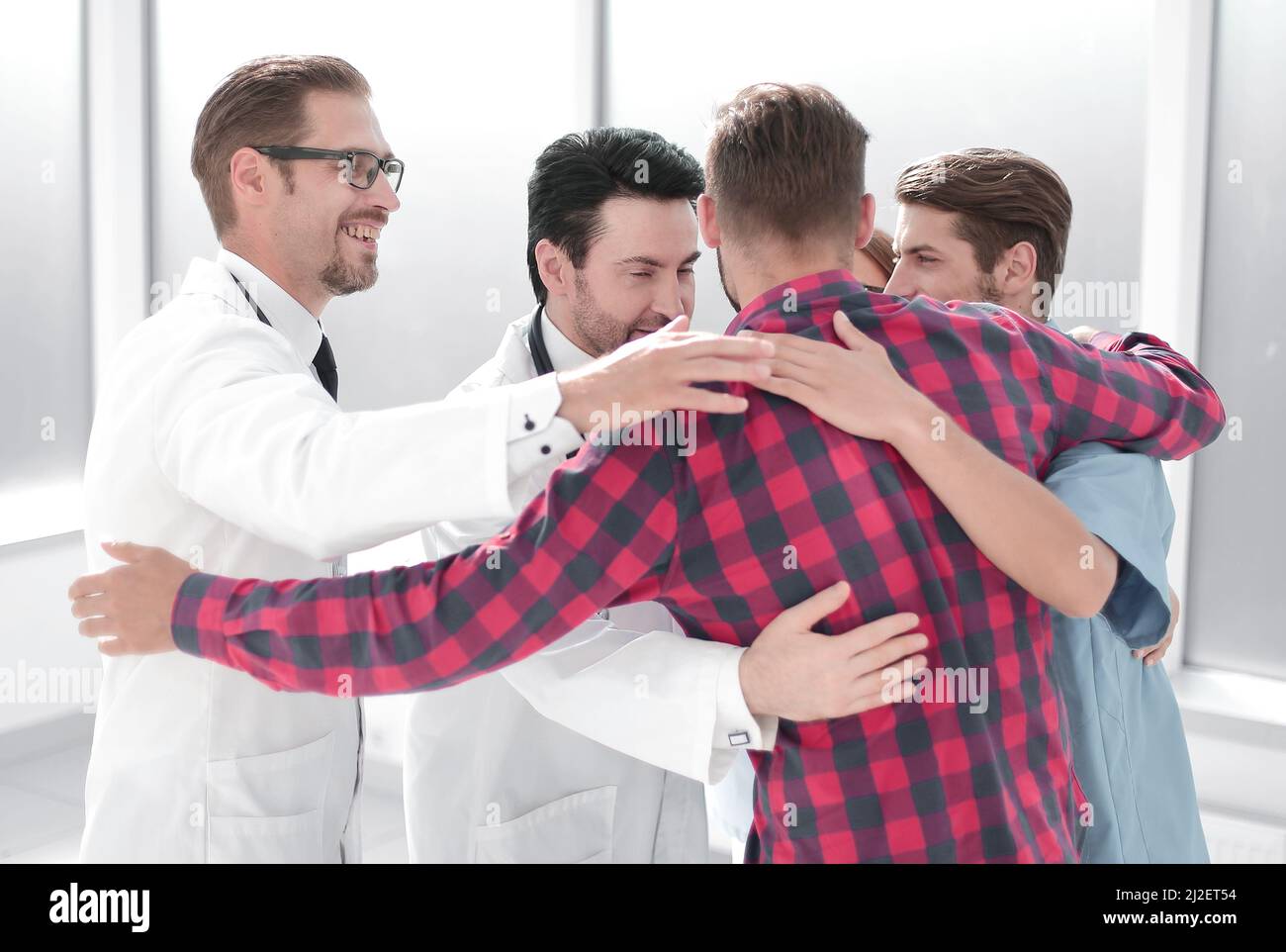 Patient hugging doctors hi-res stock photography and images - Alamy