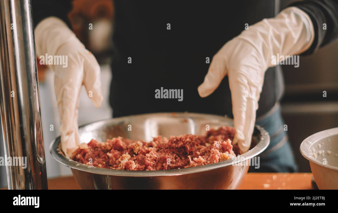 A view of human hands mixing minced meat in kitchen Stock Photo - Alamy