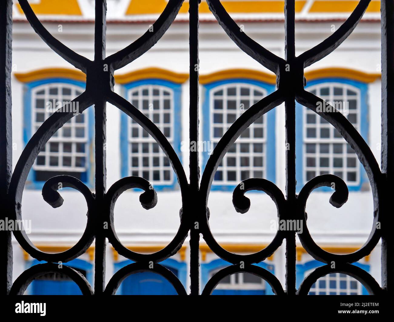 Window grid (detail) and colonial facade, Sao Joao del Rei, Brazil ...
