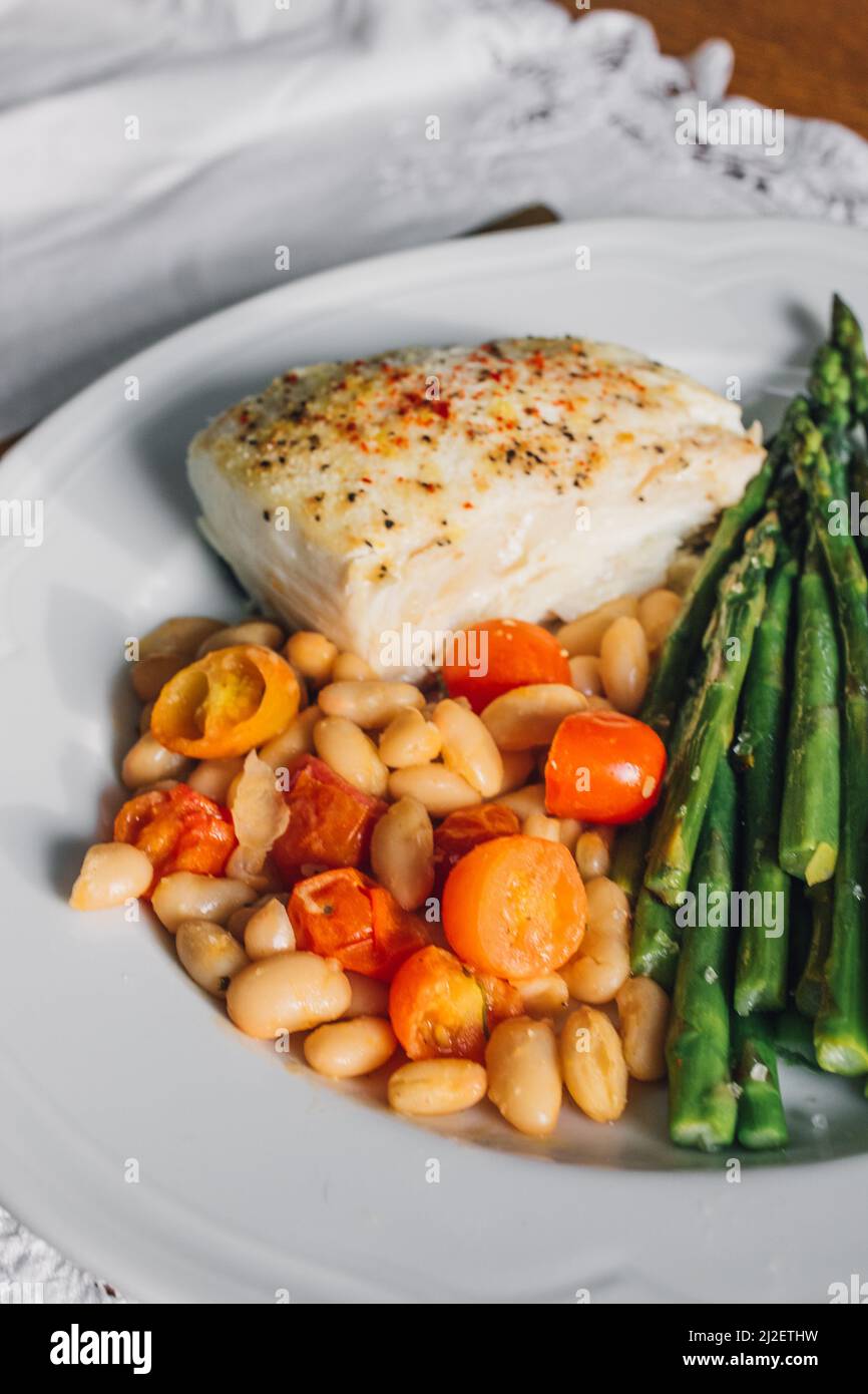 grilled fish with vegetables dinner asparagus white beans tomatoes on ...
