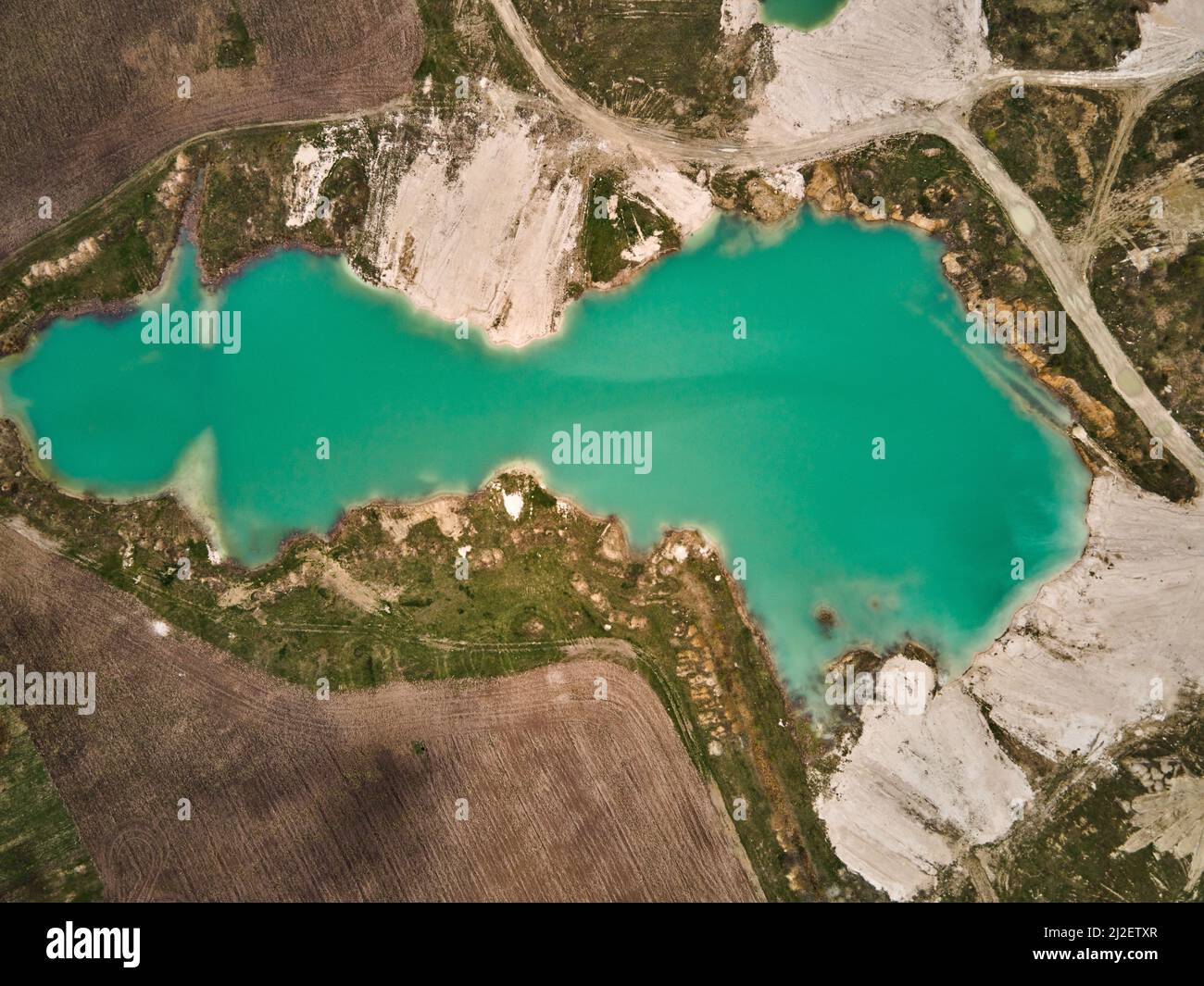 Aerial drone view Amazing industrial landscape, on Emerald lake in a ...