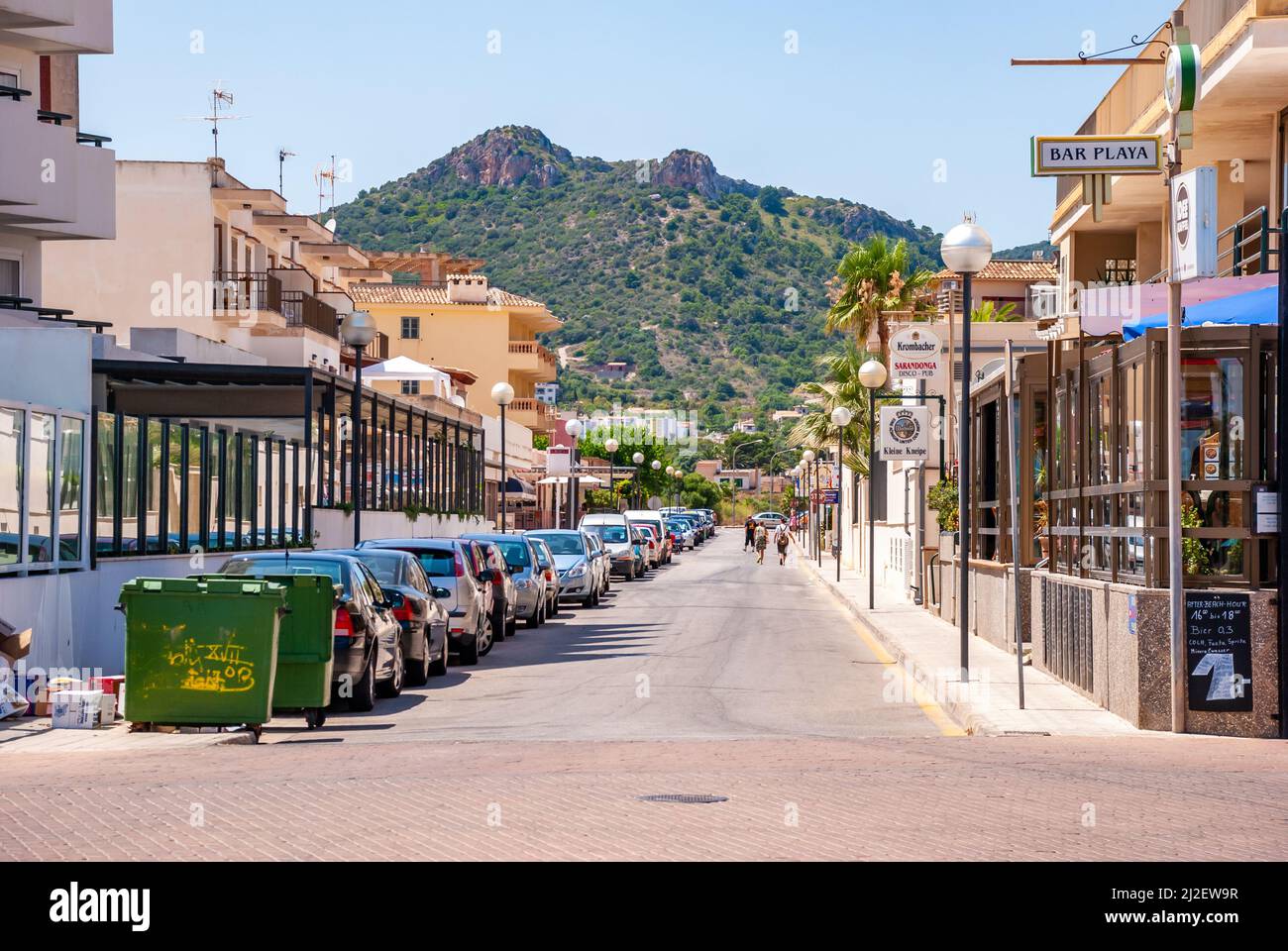 The bars next to the beach of Cala Millor Majorca with mountains in ...
