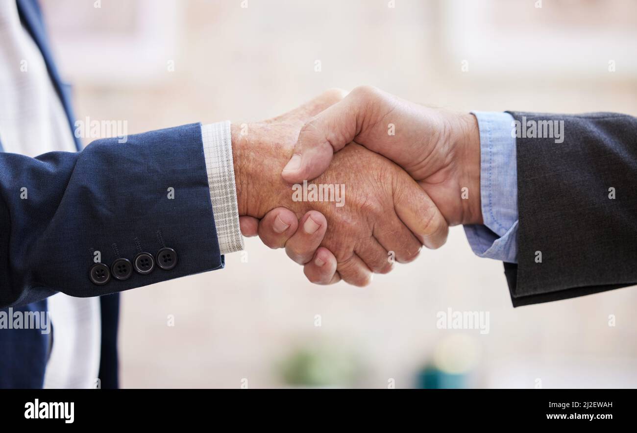 A firm handshake shows you mean business. Shot of two unrecognizable ...