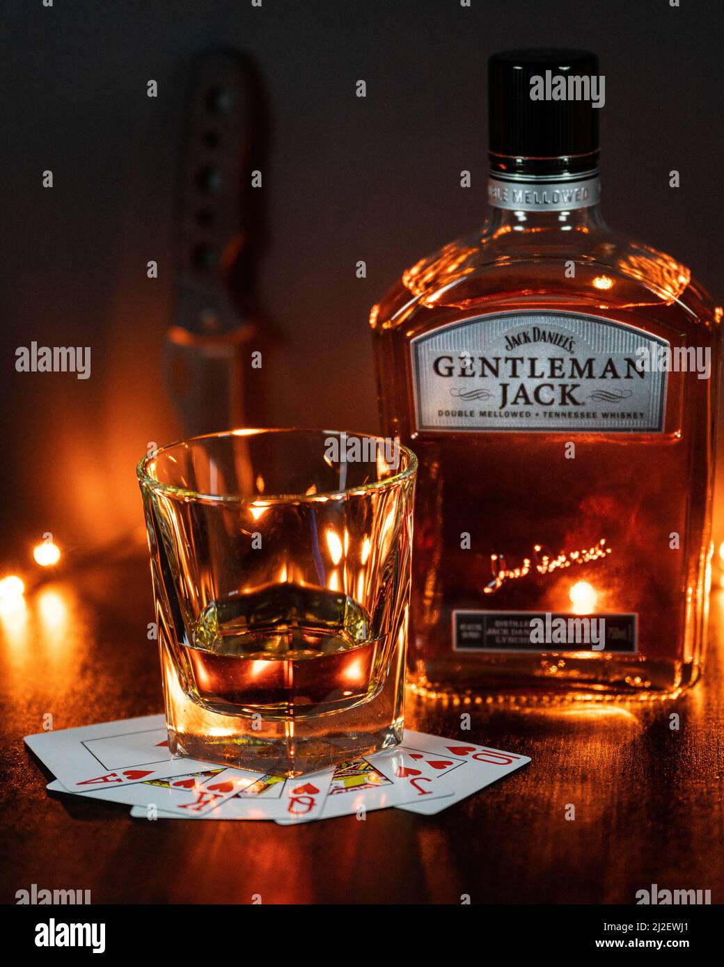 A vertical shot of a Jack Daniel's Gentleman Jack with a glass on a ...