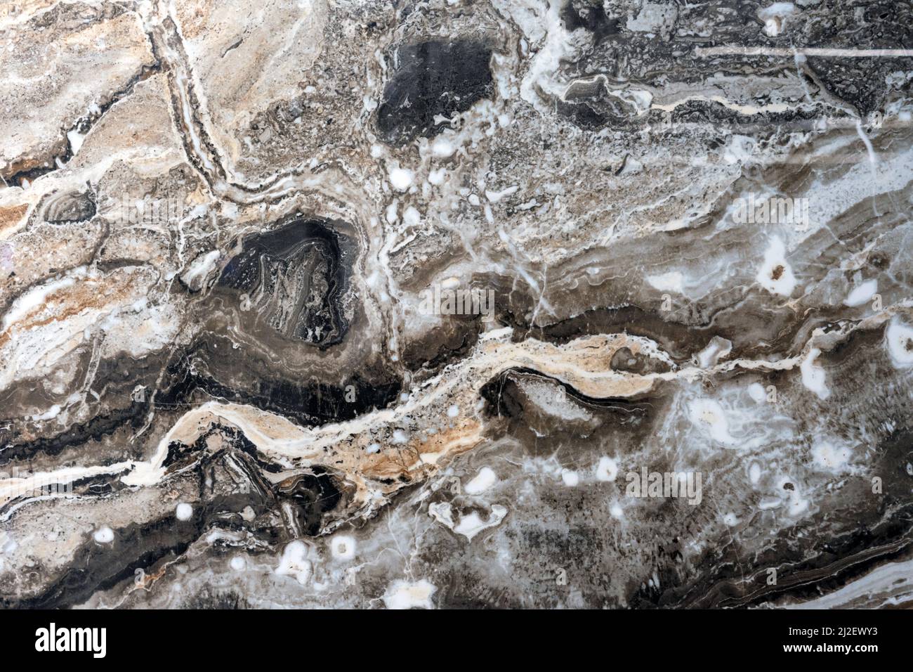 Texture of natural gray-black quartz stone with beige mineral ...