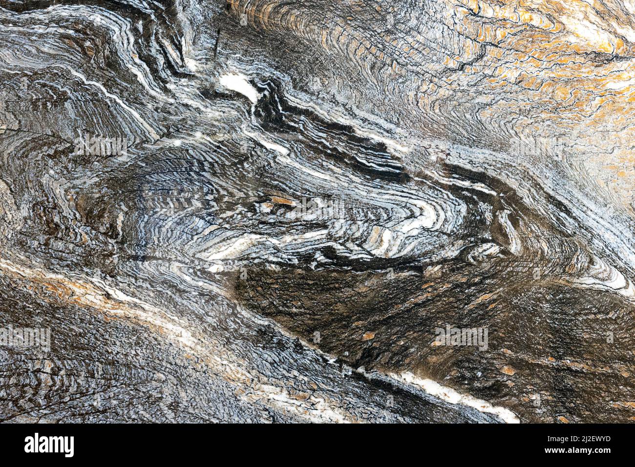Texture of natural gray-black quartz stone with orange mineral ...