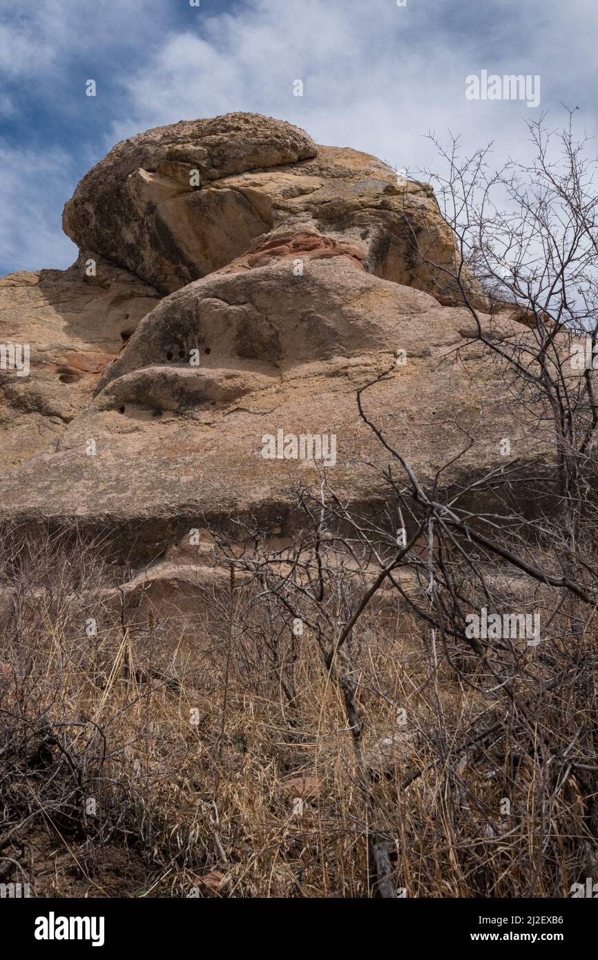 A vertical shot of a big rock formation in a forest Stock Photo - Alamy