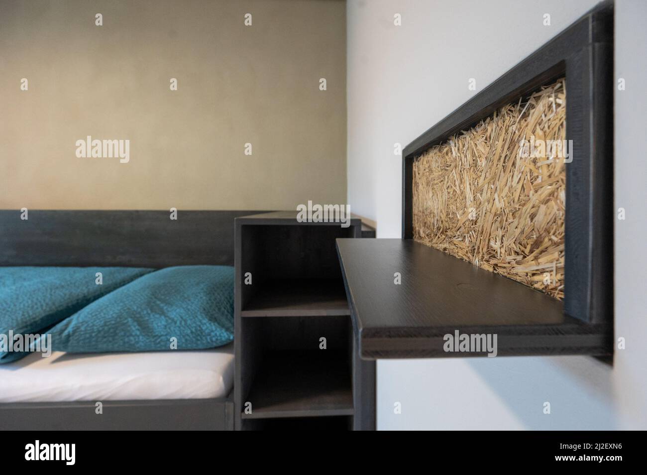 01 April 2022, Bavaria, Berching: A viewing window with straw in a ...