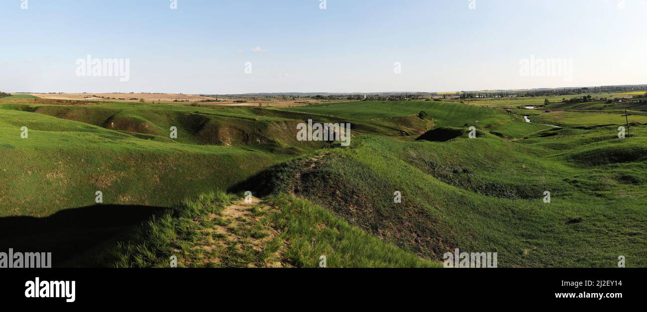 panoramic landscape, lonely green hills, blue sky in the background ...
