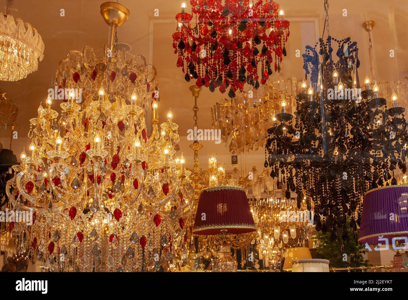 Huge Turkish style crystal chandeliers in lighting store. Horizontal ...