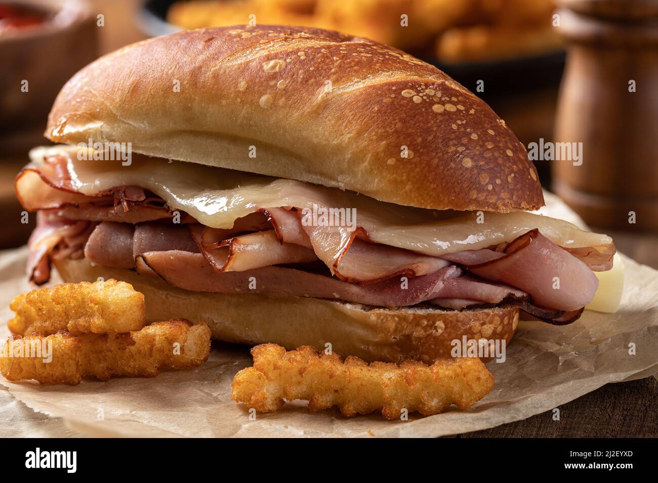 Closeup of a hot ham and cheese submarine sandwich with crispy french ...
