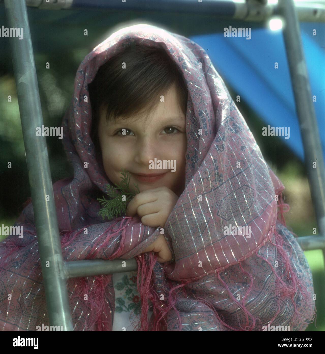 Wearing an Indian style headscarf in a English garden in the month of ...