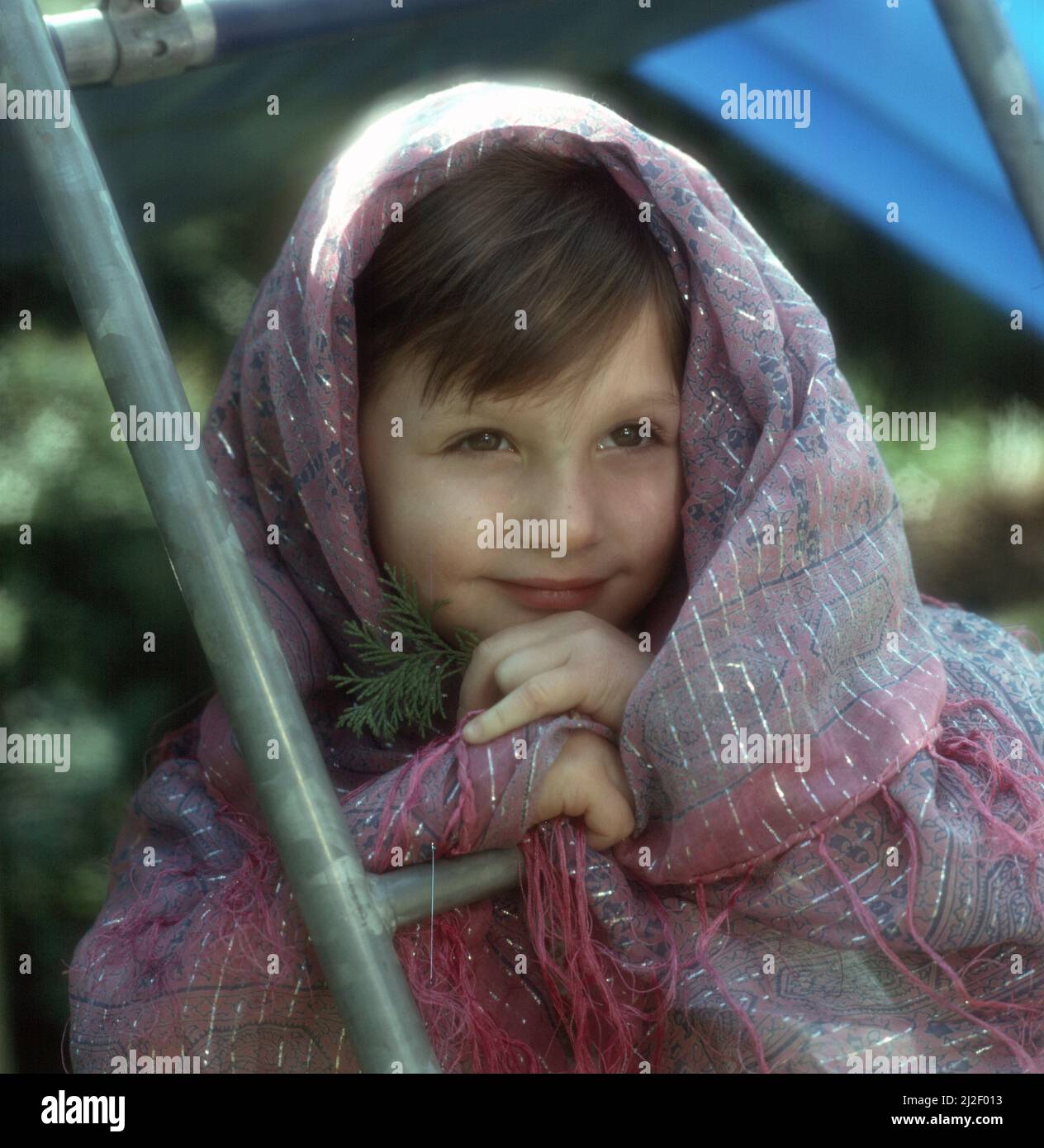 Wearing an Indian style headscarf in a English garden in the month of ...