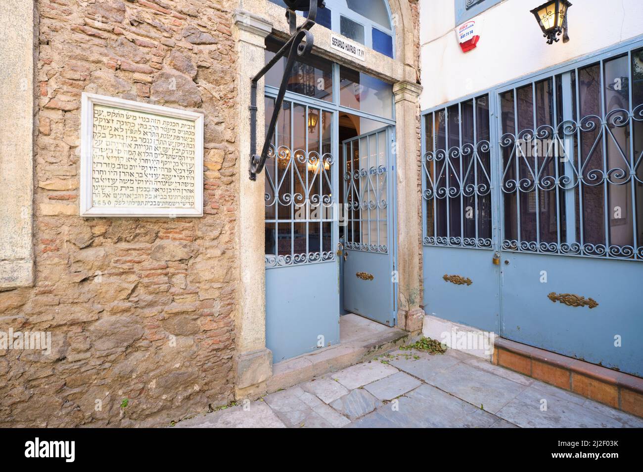 Front entrance with hebrew text wall plaque. At the Shalom synagogue in ...