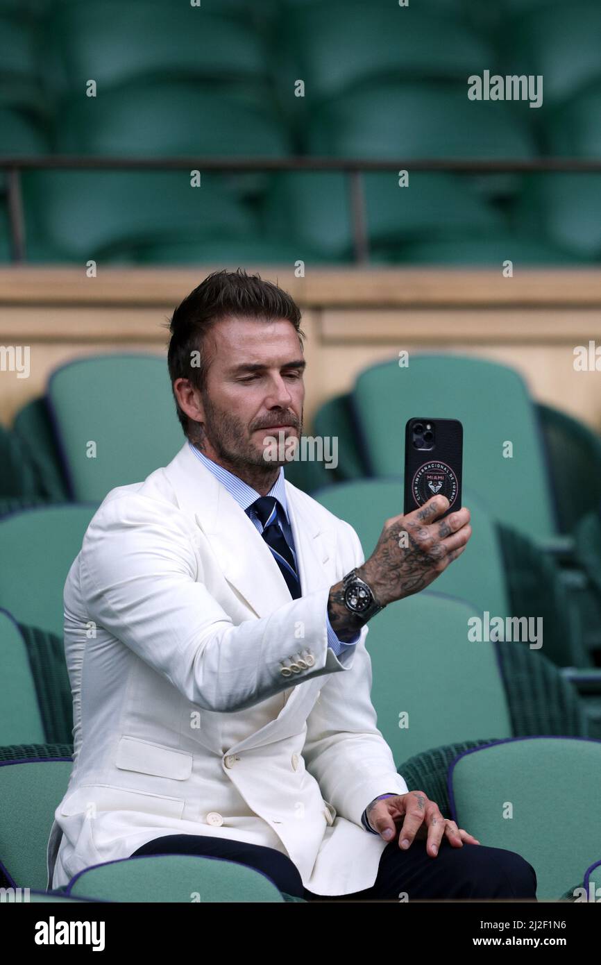 Former footballer David Beckham waits for a tennis match to start ...