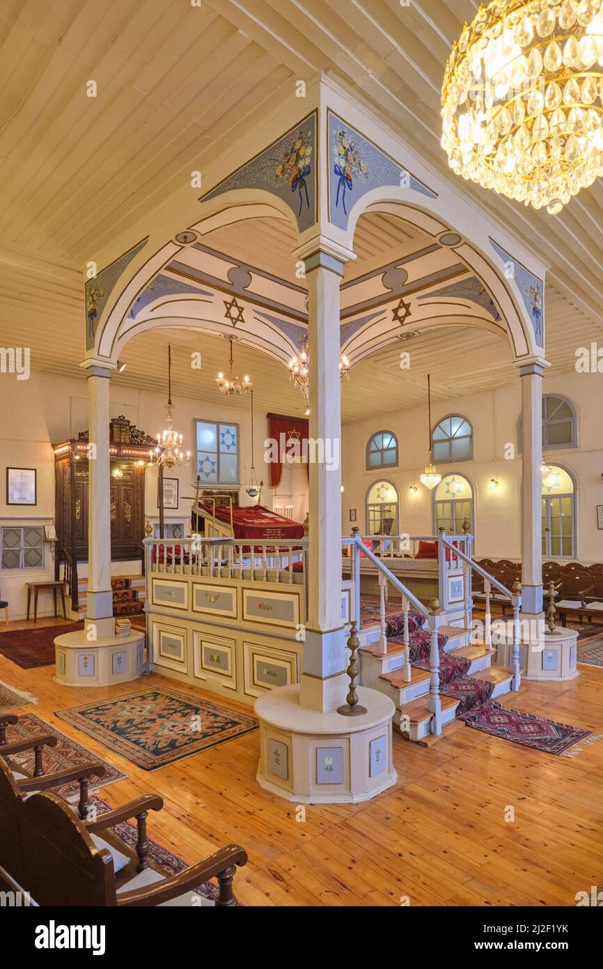 The painted yellow and blue central, square wood bima. At the Algazi ...