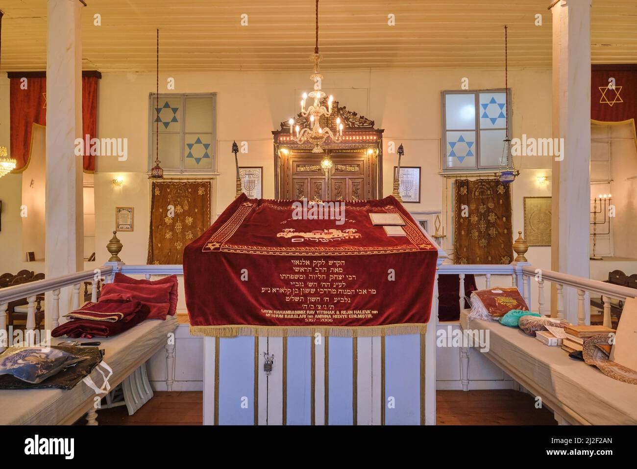 Red cloth covering the torah reading spot in the central bima with the ...