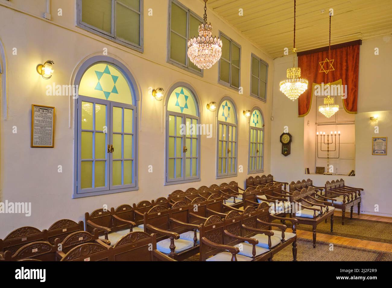 A look at the various rows of wood seating, benches along the side of ...