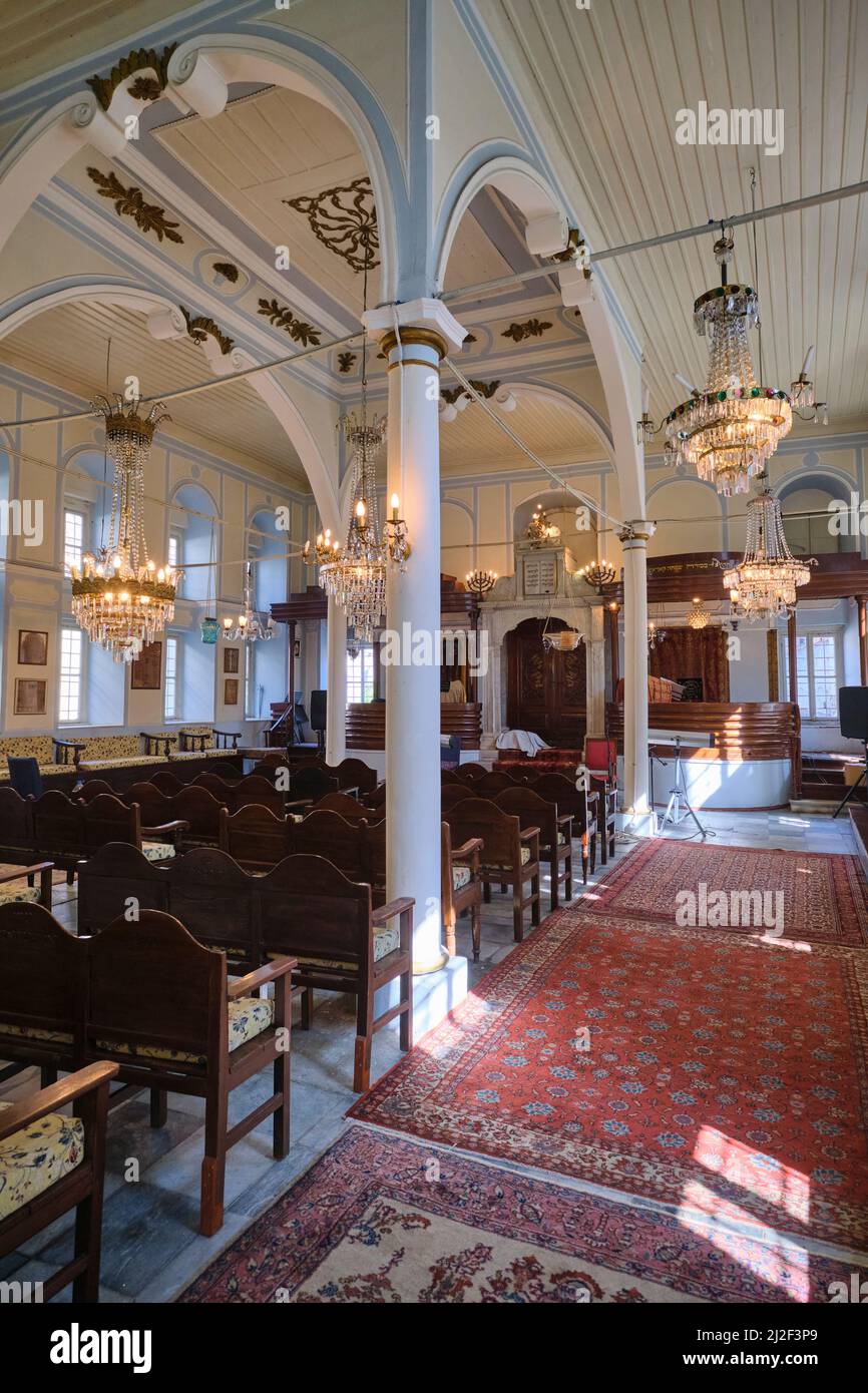 Interior view of the space with the bima and torah along the back wall ...