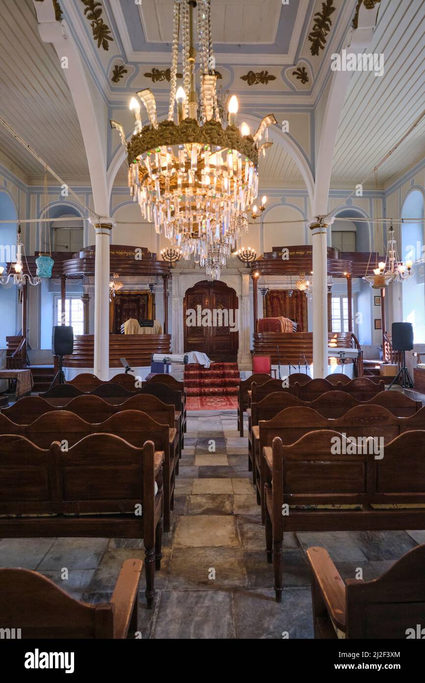Interior view of the space with the bima and torah along the back wall ...
