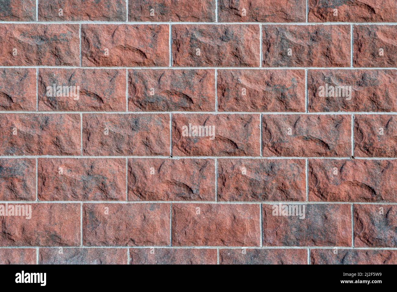 texture of red sandstone wall from a modern building facade Stock Photo ...
