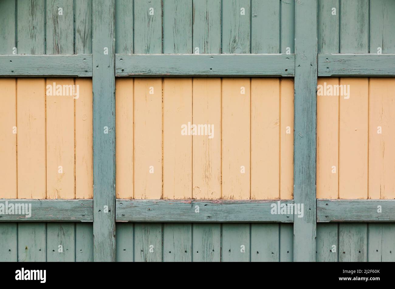 Green and cream Coloured wood panels on beach hut, Herne Bay, Kent ...