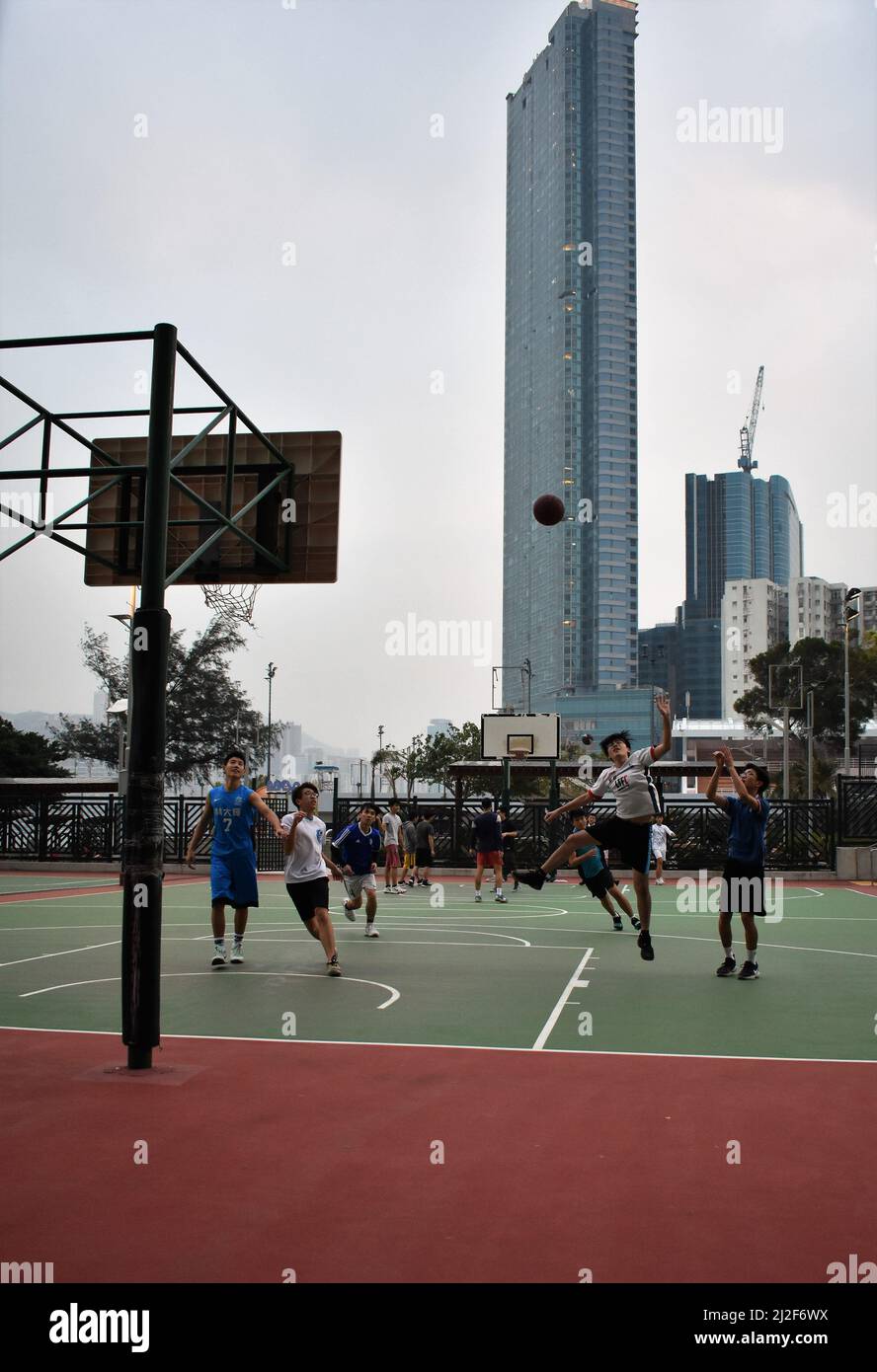 The vertical shot of children playing basketball on the school ...