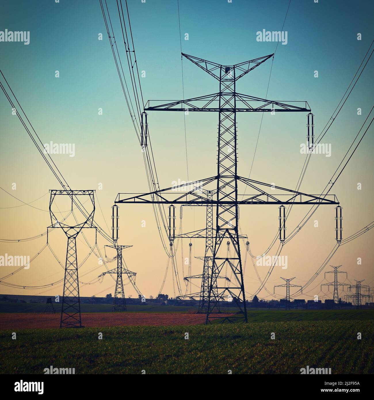High voltage pylons. Concept for technology and industry. Rising energy ...