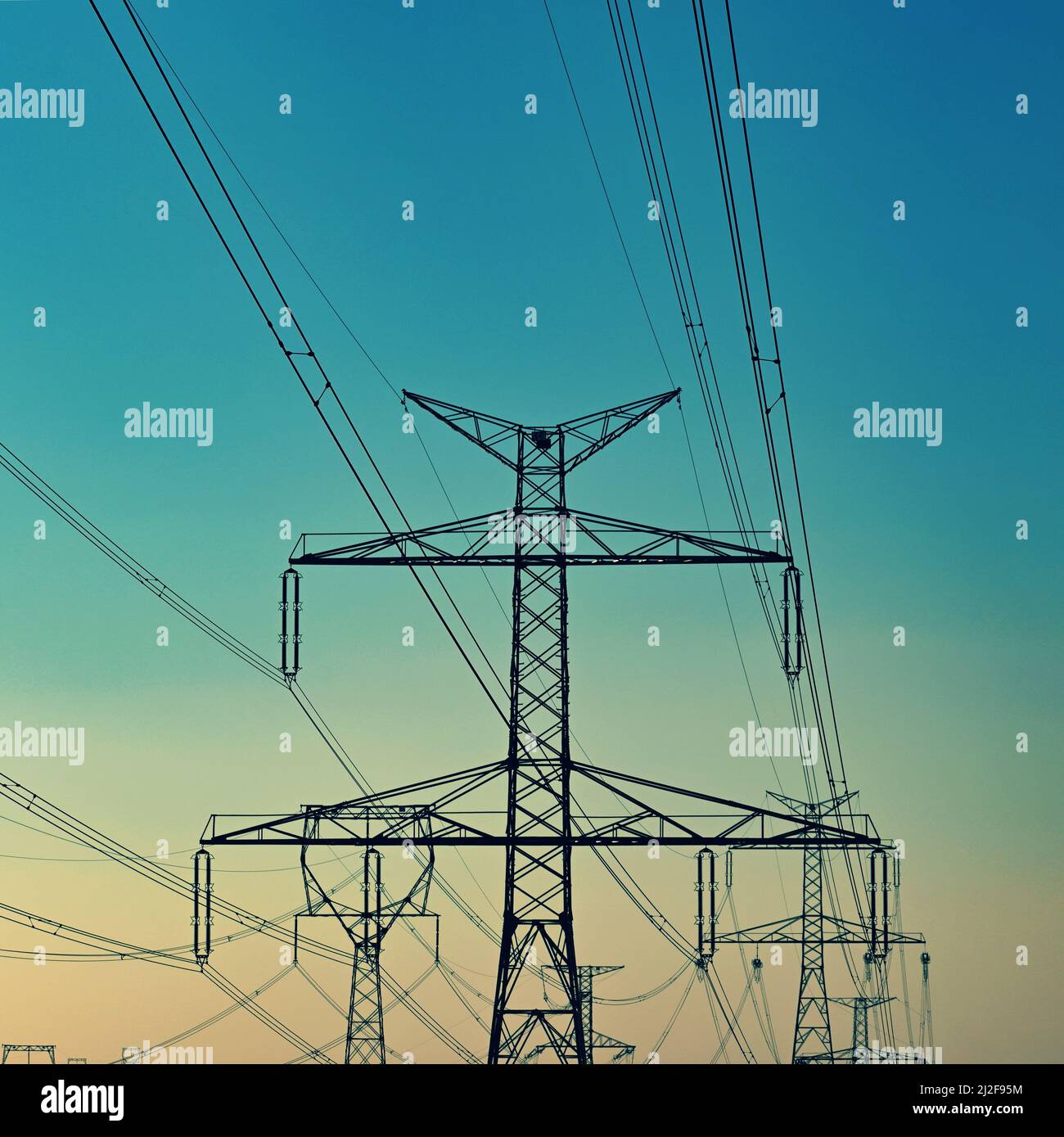 High voltage pylons. Concept for technology and industry. Rising energy ...