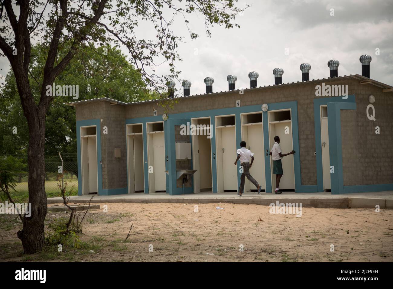 Students make use of new bathroom toilets - outdoor pit latrines - at a ...