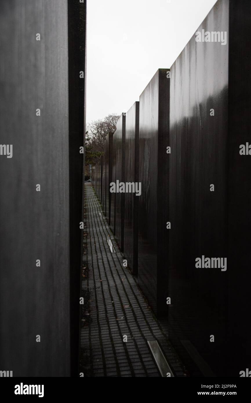 A vertical shot of a small walk passage between buildings Stock Photo ...