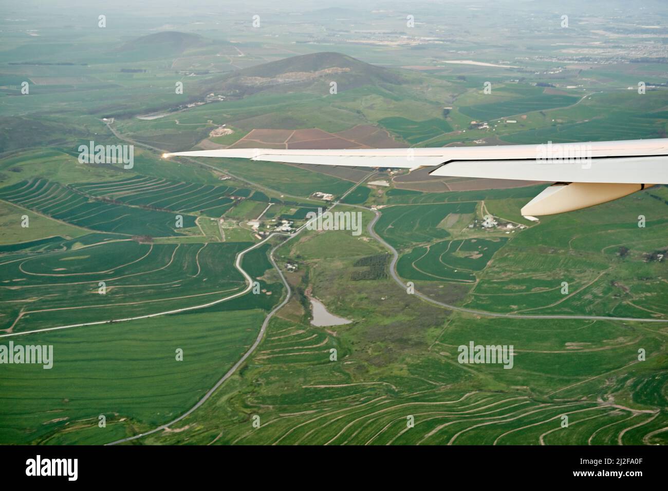 High above the ground. High angle shot of the views from an airplane ...