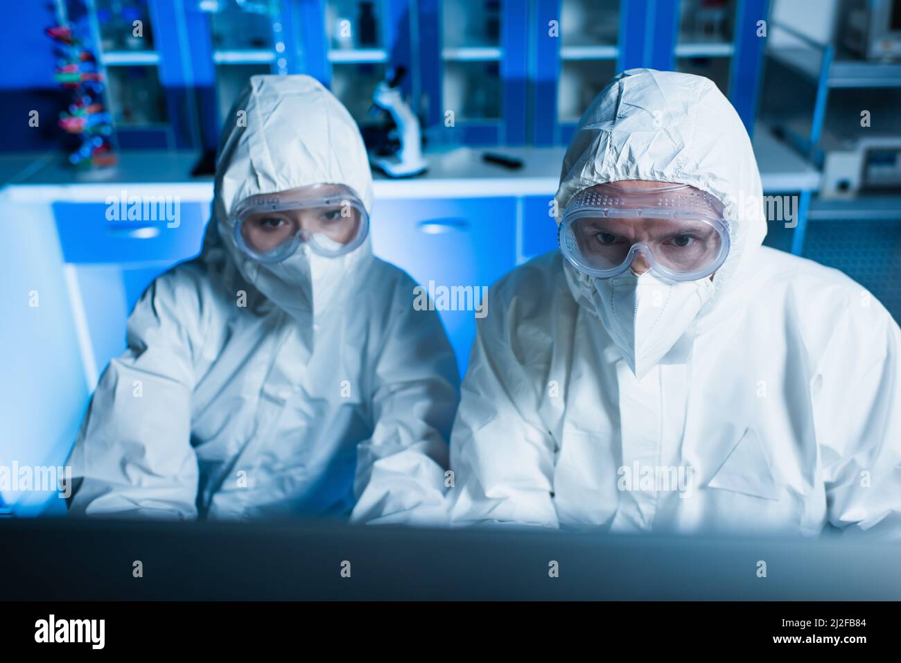 Hazmat suits in science lab hi-res stock photography and images - Alamy