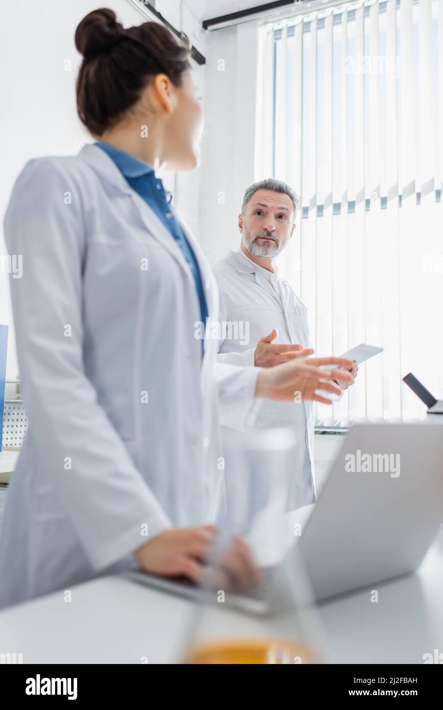 Scientists talking in lab hi-res stock photography and images - Alamy