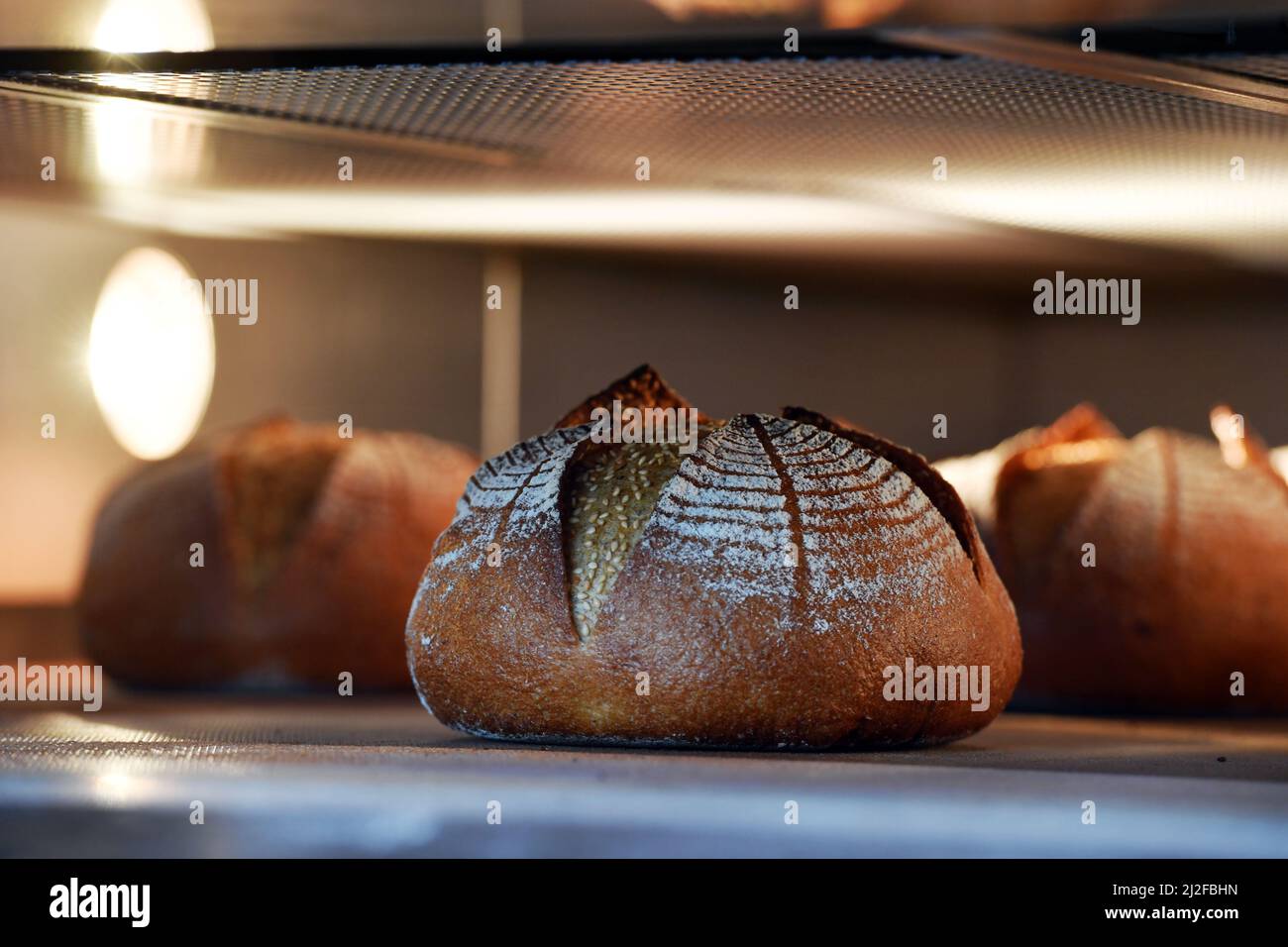 Baking Bread in the oven - Paris - France Stock Photo - Alamy
