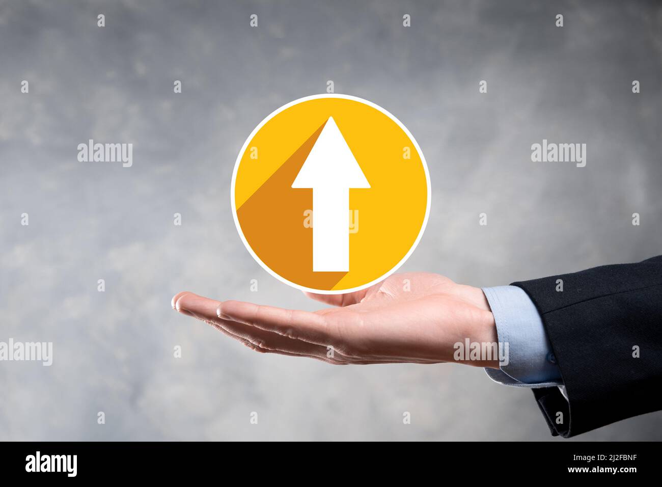 Businessman hold graph, arrow of positive growth icon.pointing at ... Businessman hold graph, arrow of positive growth icon.pointing at ...