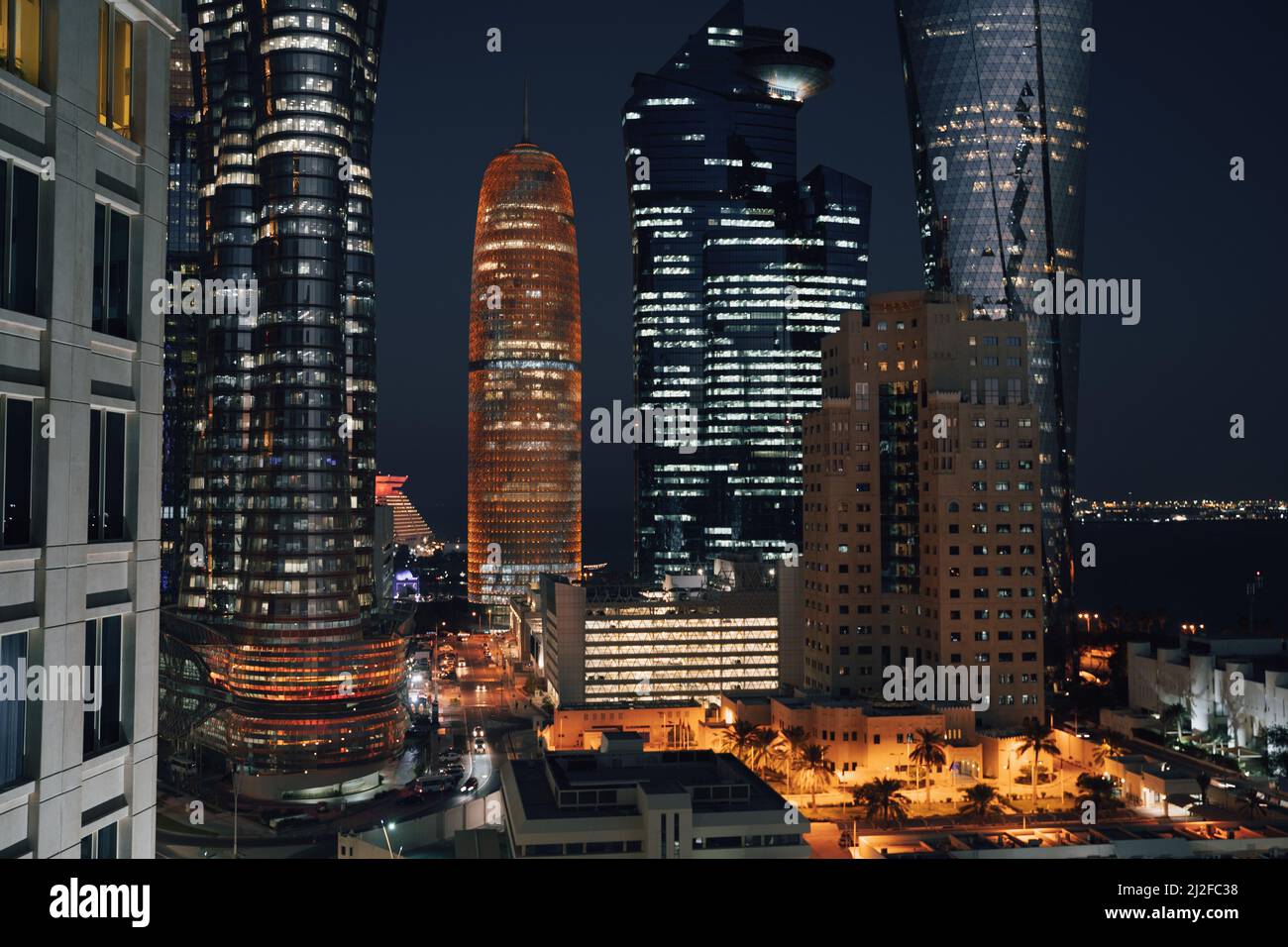 Doha, Qatar- March 03,2022 : Qatar skyline during sunset with colorful ...