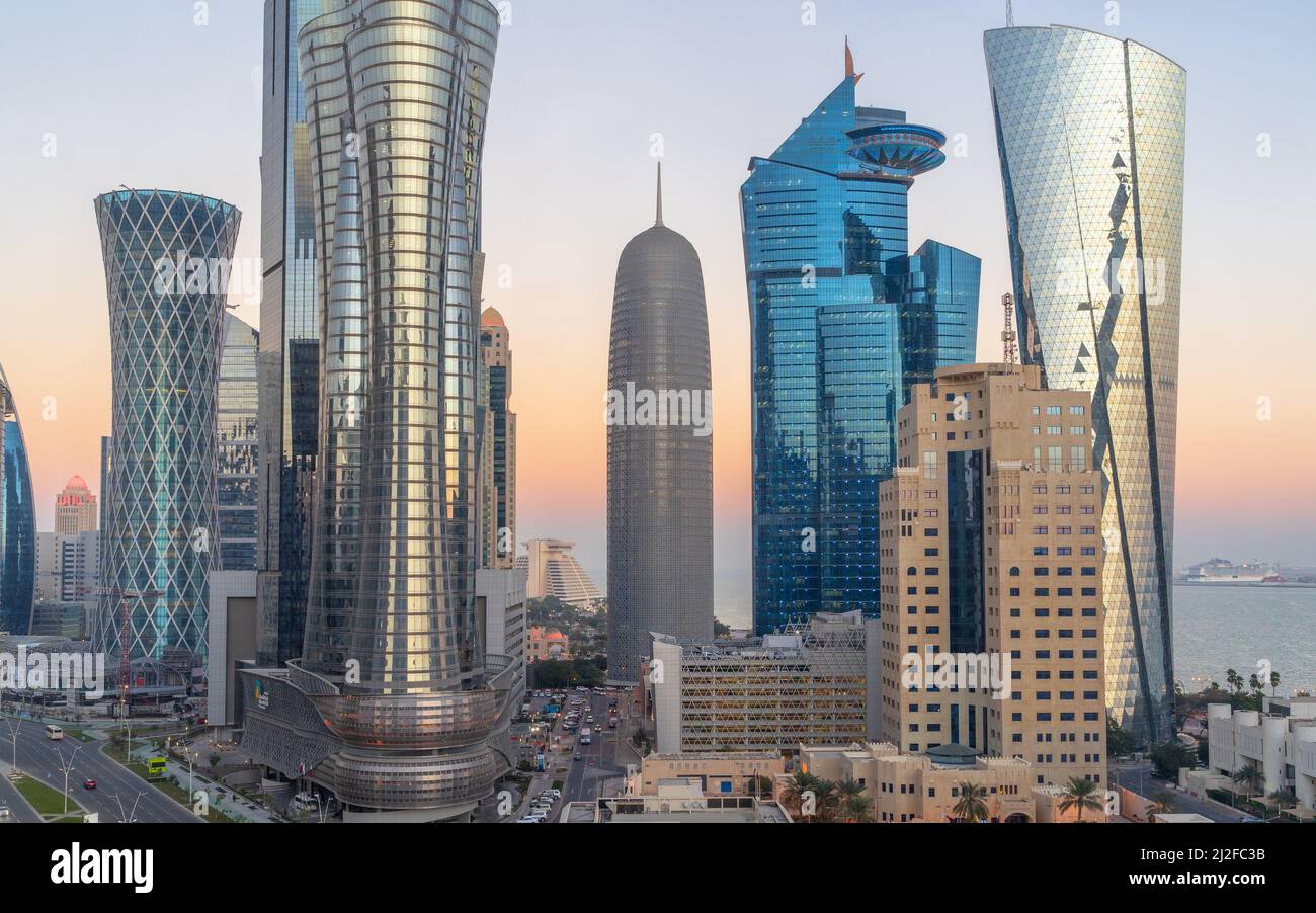 Doha, Qatar- March 03,2022 : Qatar skyline during sunset with colorful ...