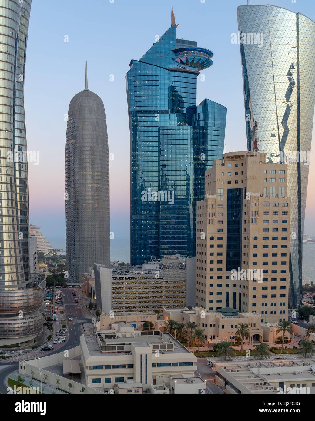 Doha, Qatar- March 03,2022 : Qatar skyline during sunset with colorful ...