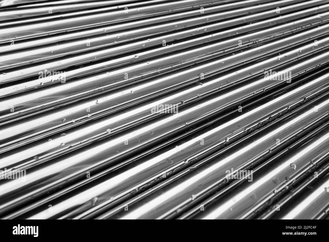 Steel tubes - Industrial abstract background Stock Photo - Alamy