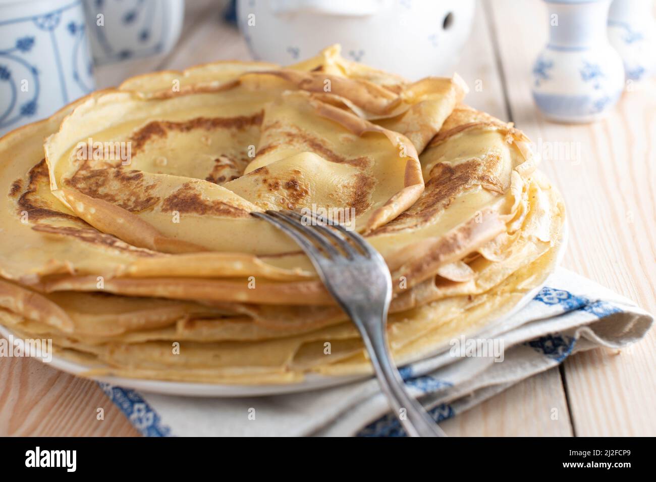 Thin golden crepes pancakes hi-res stock photography and images - Alamy