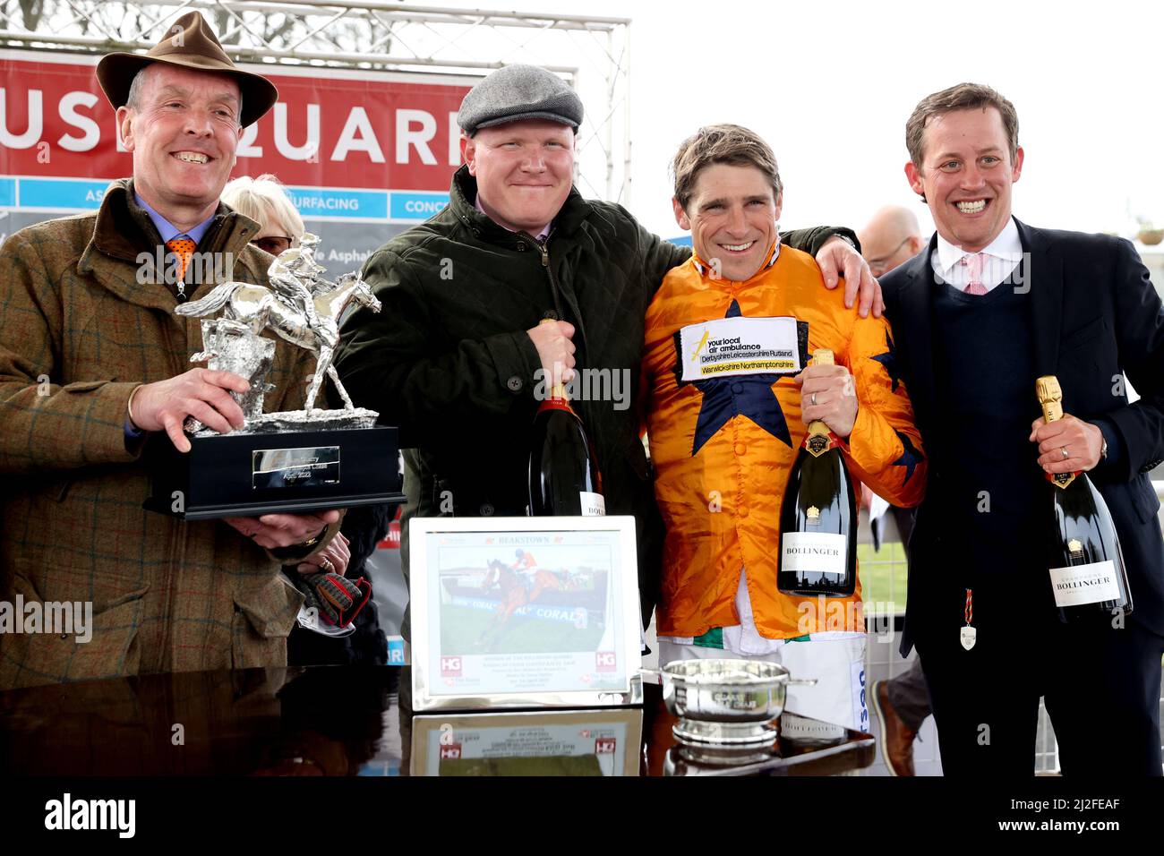 Jockey Harry Skelton (second right) celebrates with owner Bryan Drew ...