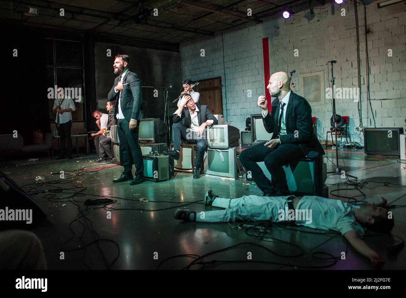 Large group of theater actor artists on stage perform play for audience ...