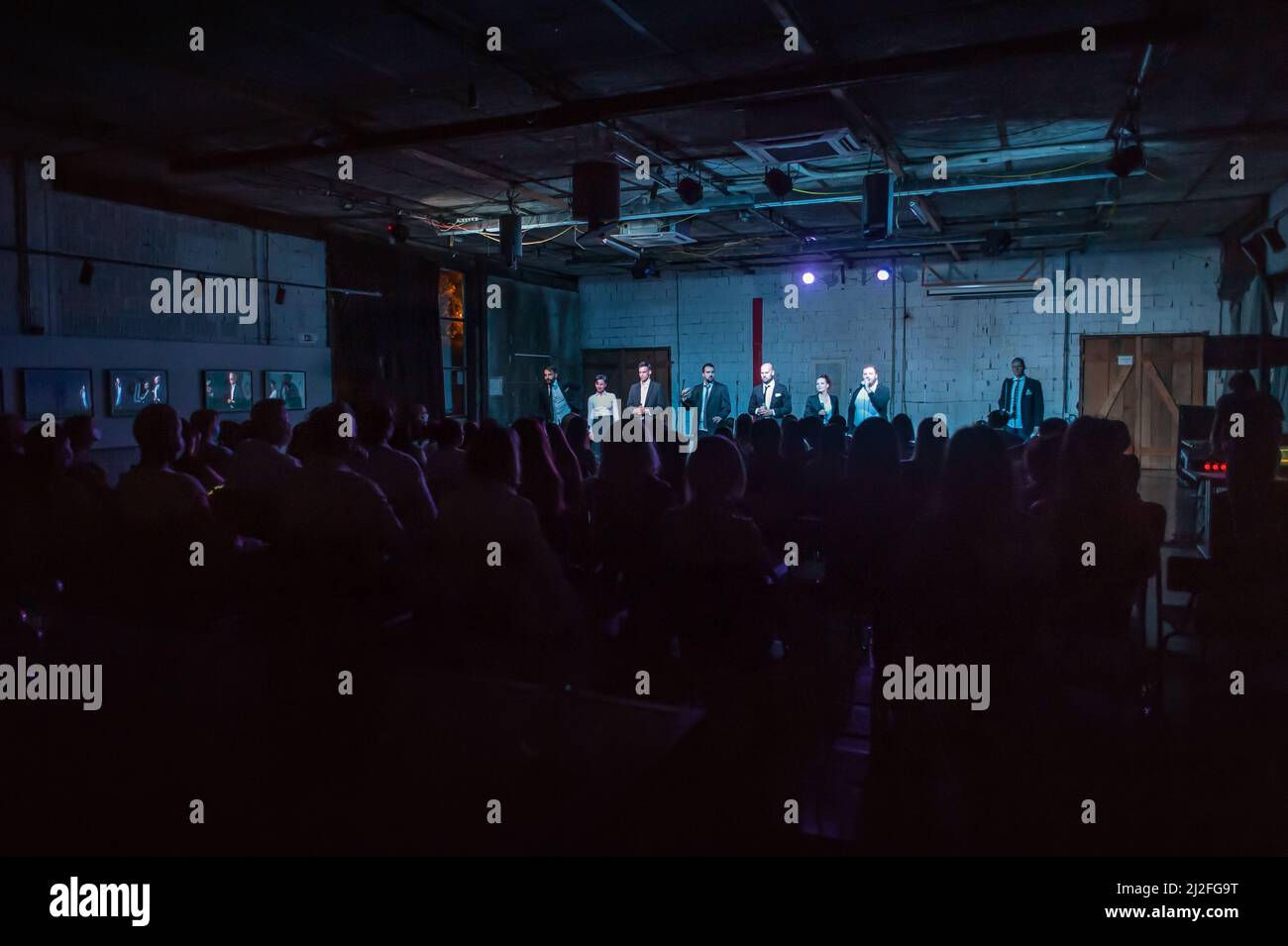 Large group of theater actor artists on stage perform play for audience ...