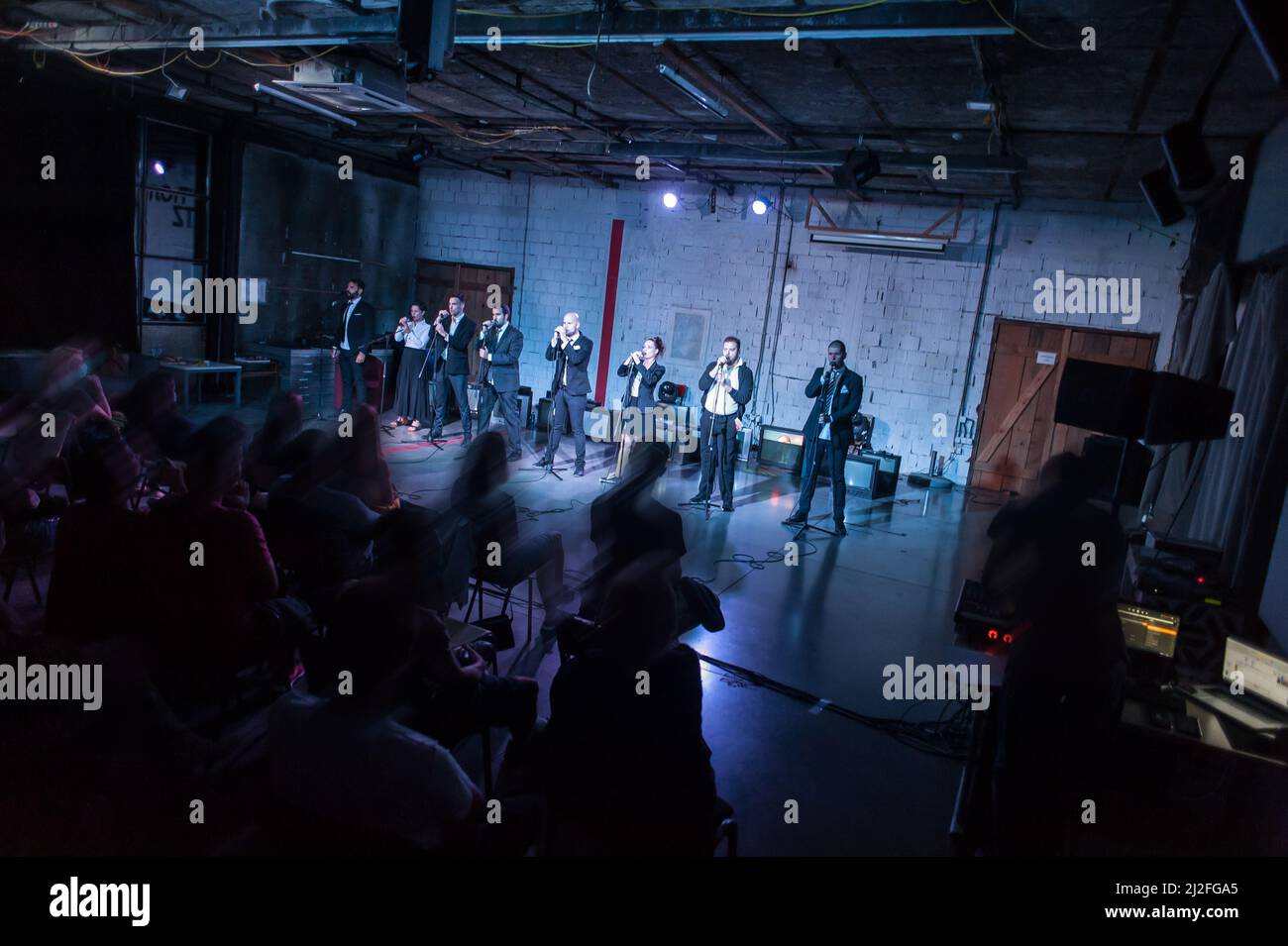Large group of theater actor artists on stage perform play for audience ...