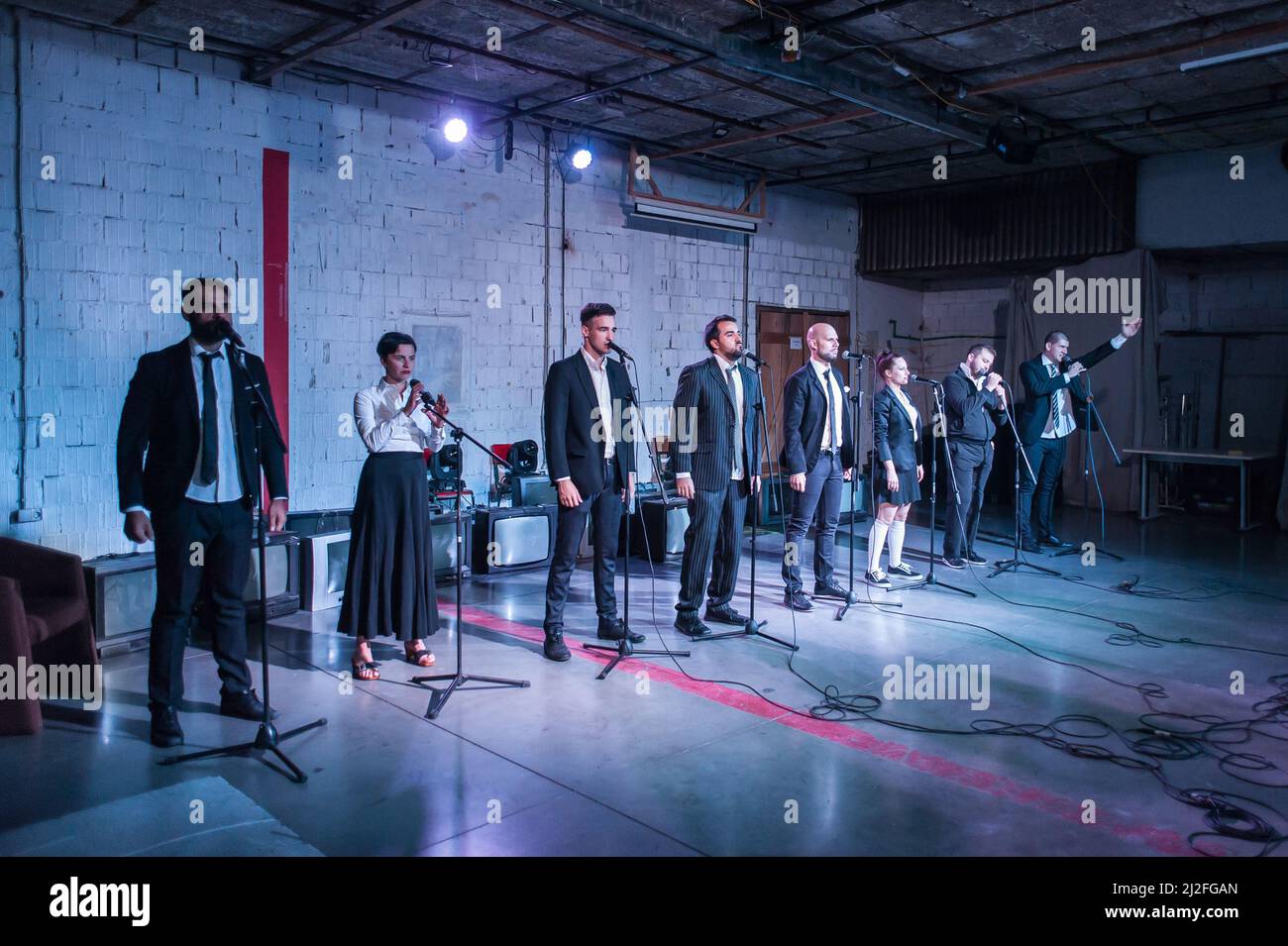 Large group of theater actor artists on stage perform play for audience ...
