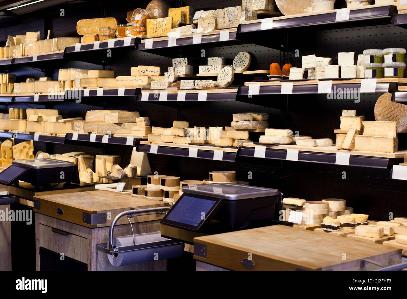 Large display of cheeses on a dairy shop Stock Photo - Alamy