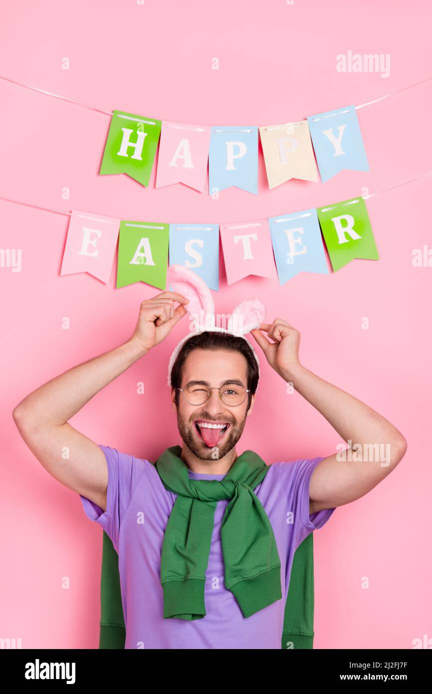 Photo of funny good mood male fooling around showing tongue celebrate ...